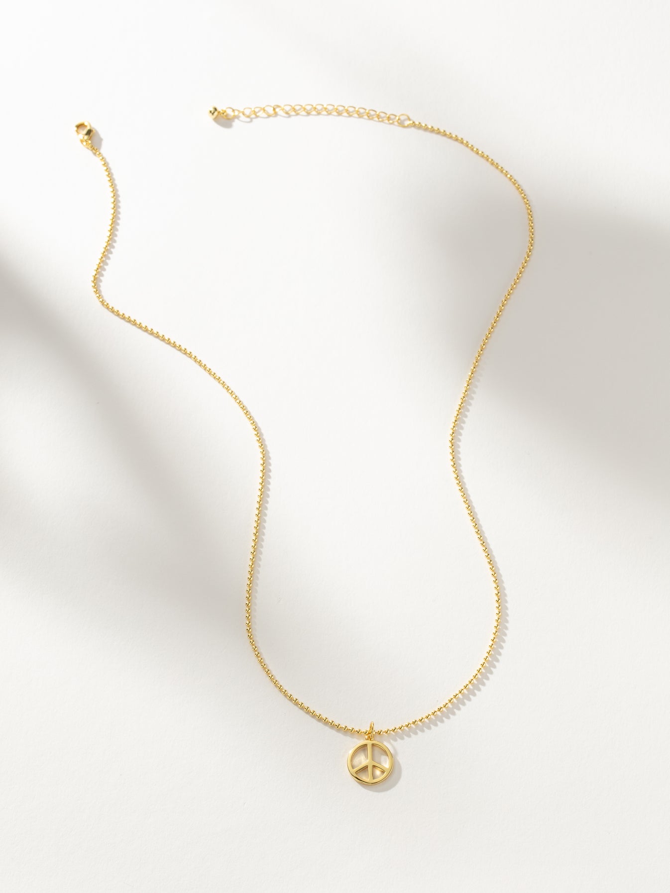 Gold and Silver Peace Sign Pendant Necklace | Uncommon James