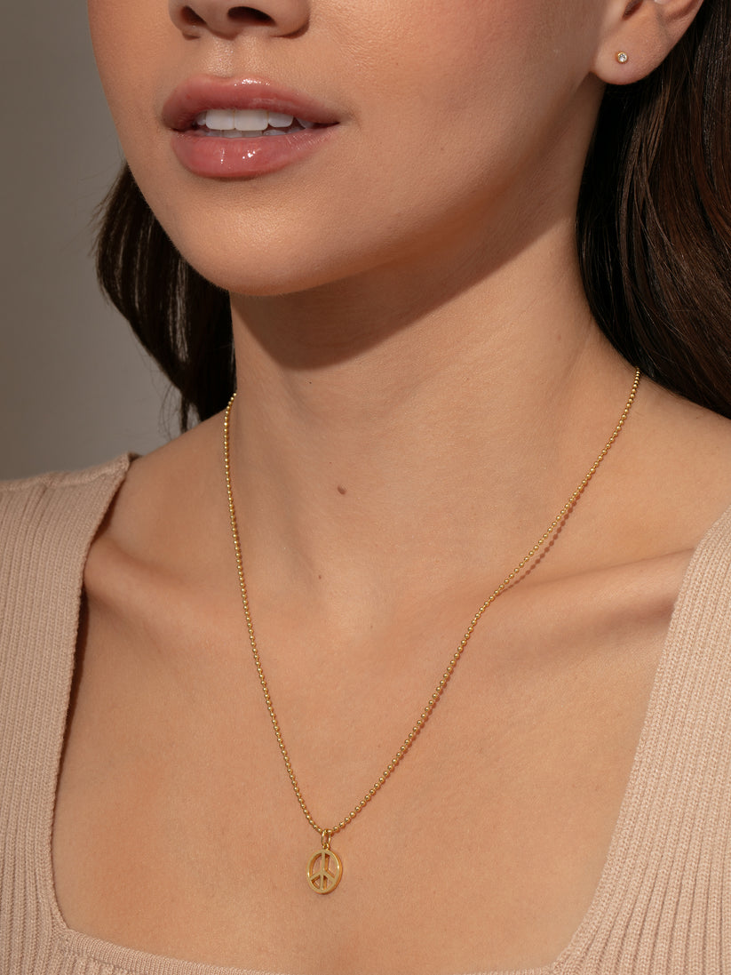 Gold and Silver Peace Sign Pendant Necklace | Uncommon James